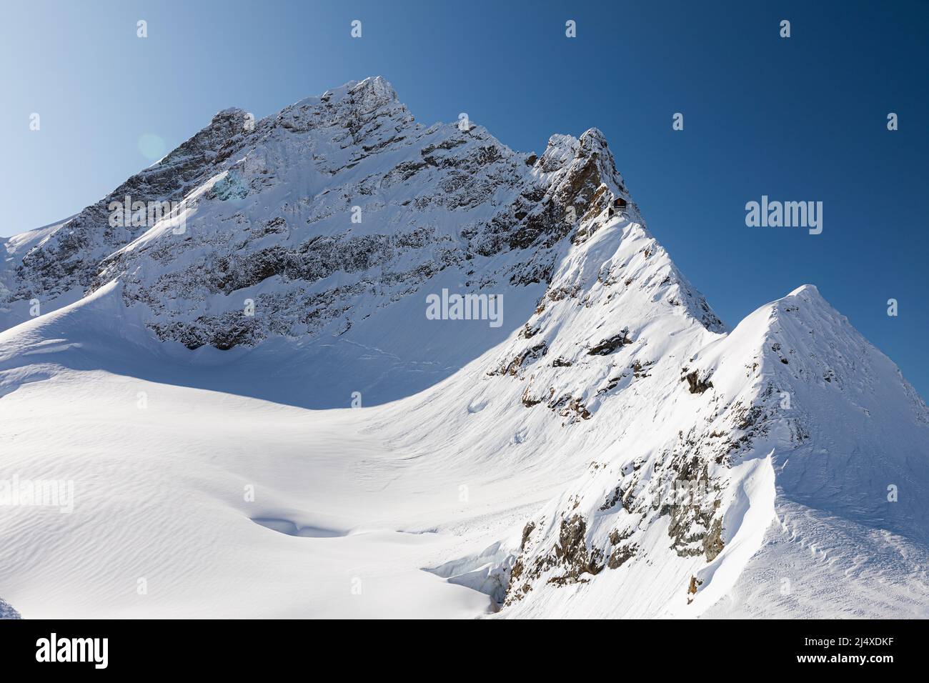 Snow-capped mountain with blue sky in Jungfrau, Interlaken, Switzerland ...