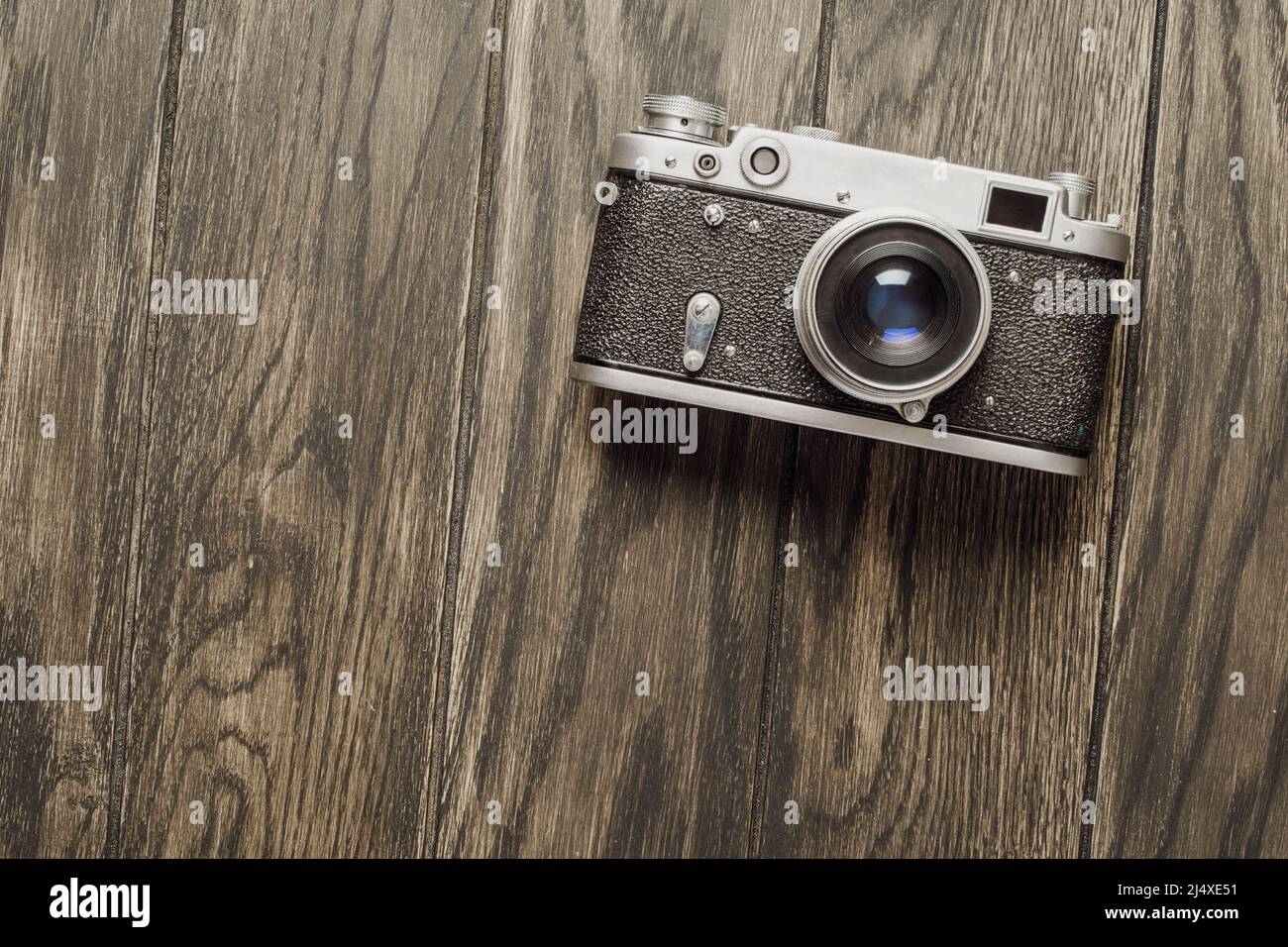 Retro camera on wooden oak table with copy space, top view Stock Photo ...