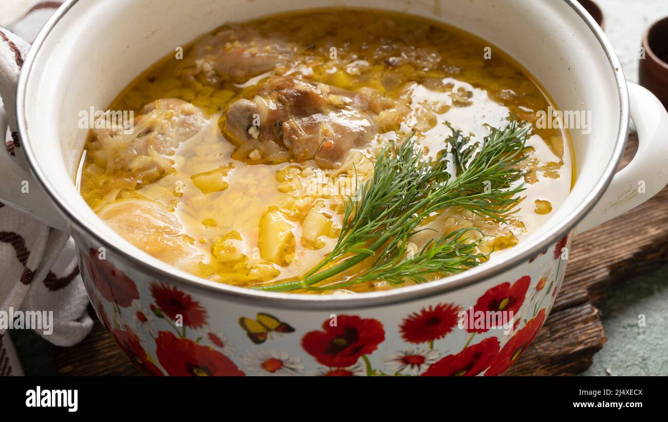 Delicious german soup eintopf with chicken and sauerkraut on the dinner ...