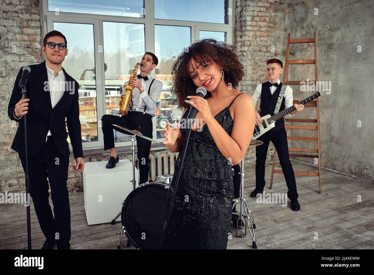 Young international musicians, a band performing on the loft stage. The ...