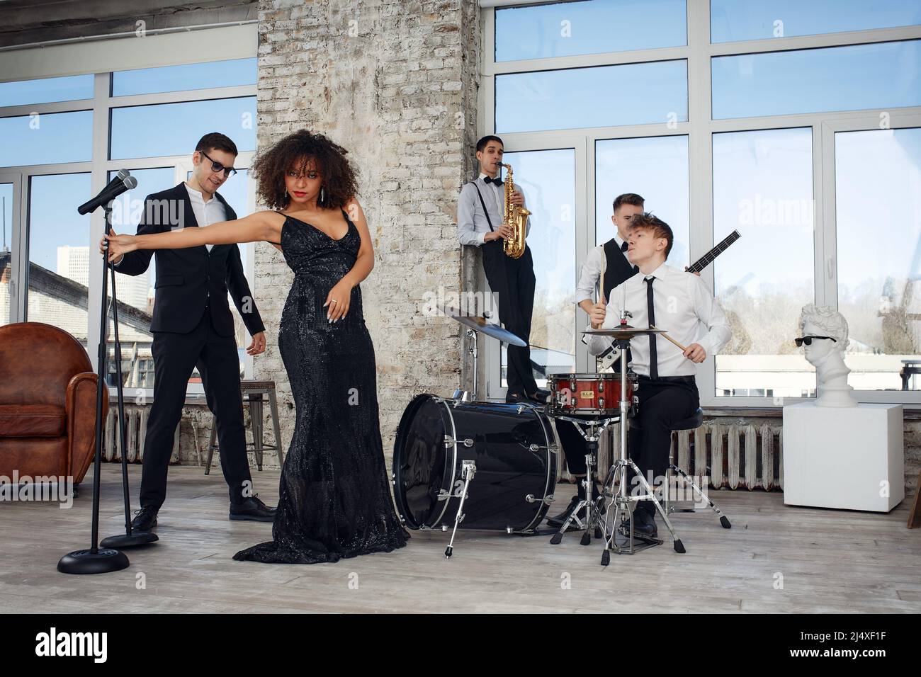 Young international musicians, a band performing on the loft stage. The ...