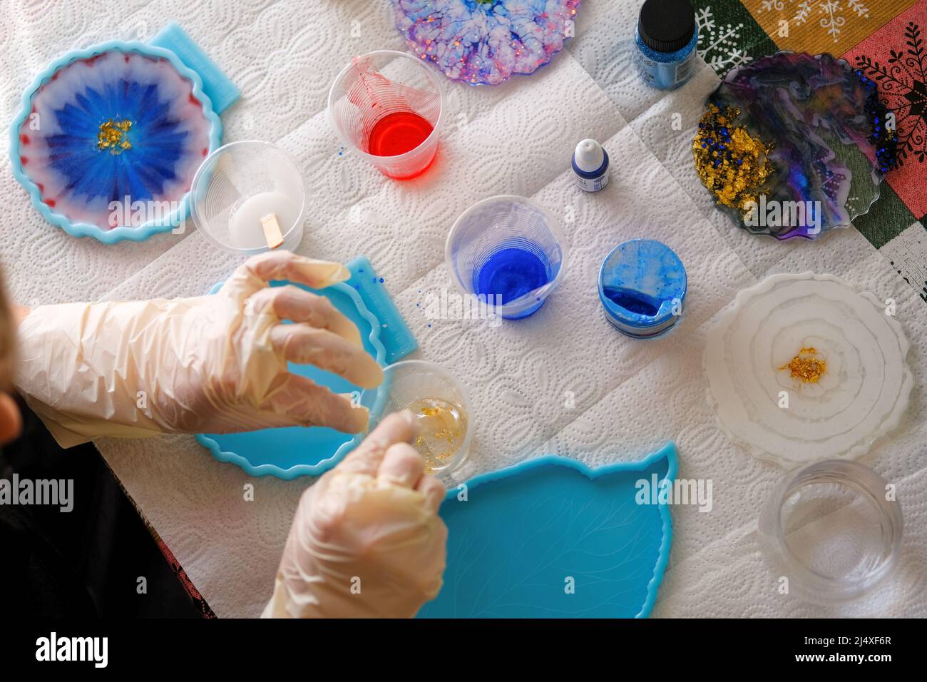 Woman making epoxy resin arts and crafts Stock Photo - Alamy