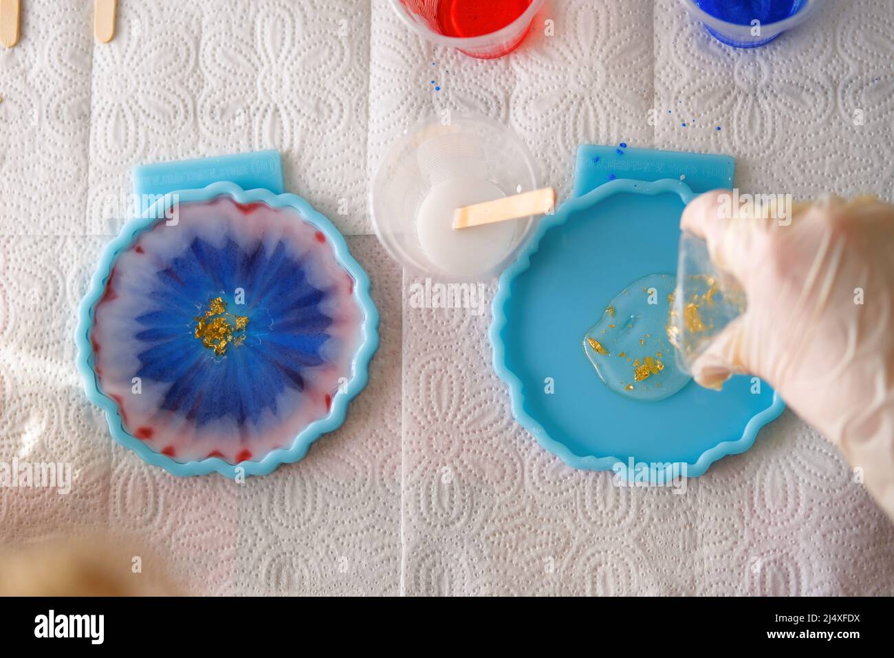 Woman making epoxy resin arts and crafts Stock Photo - Alamy