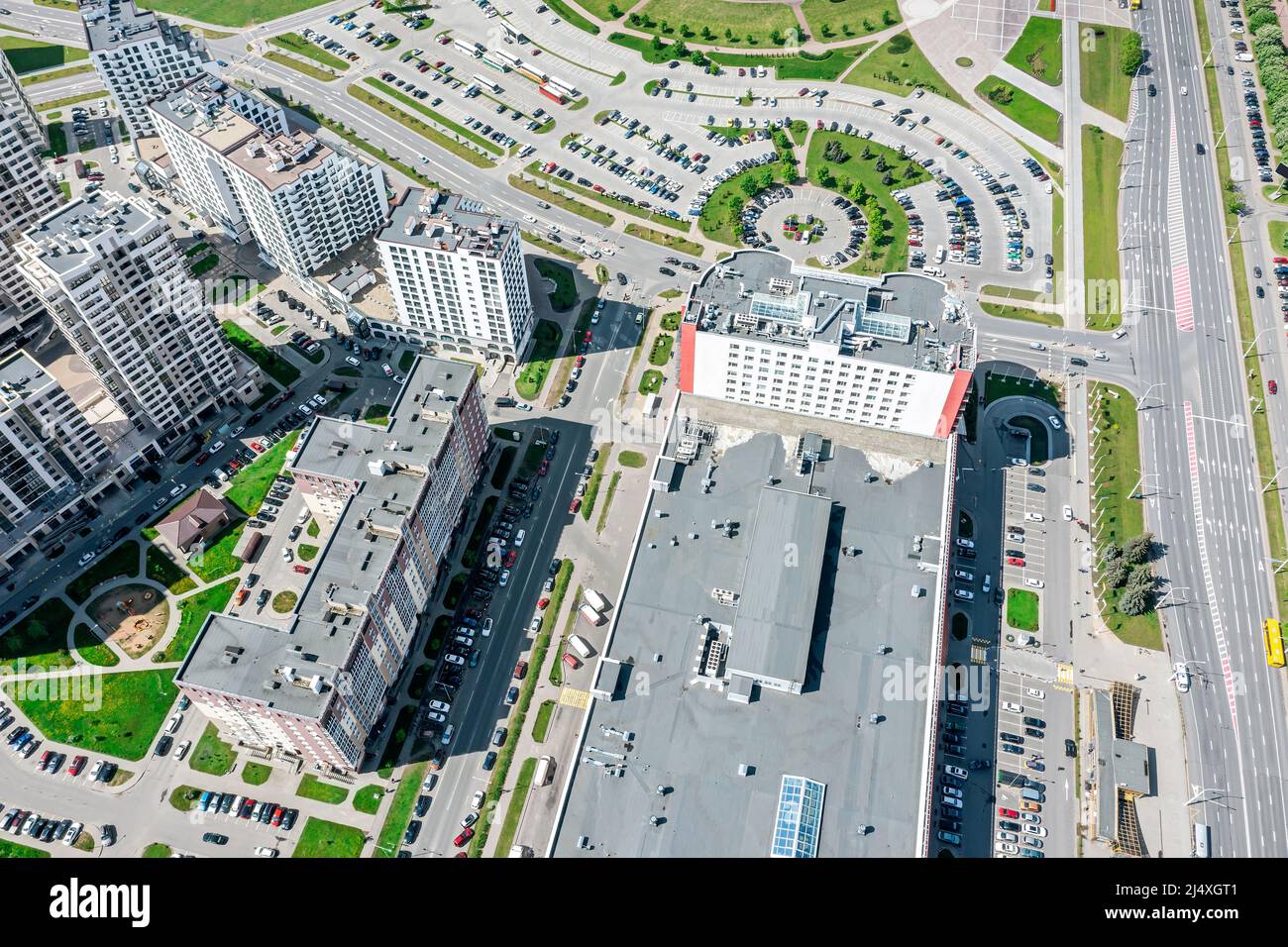 residential area with apartment buildings, shopping mall and carpark ...