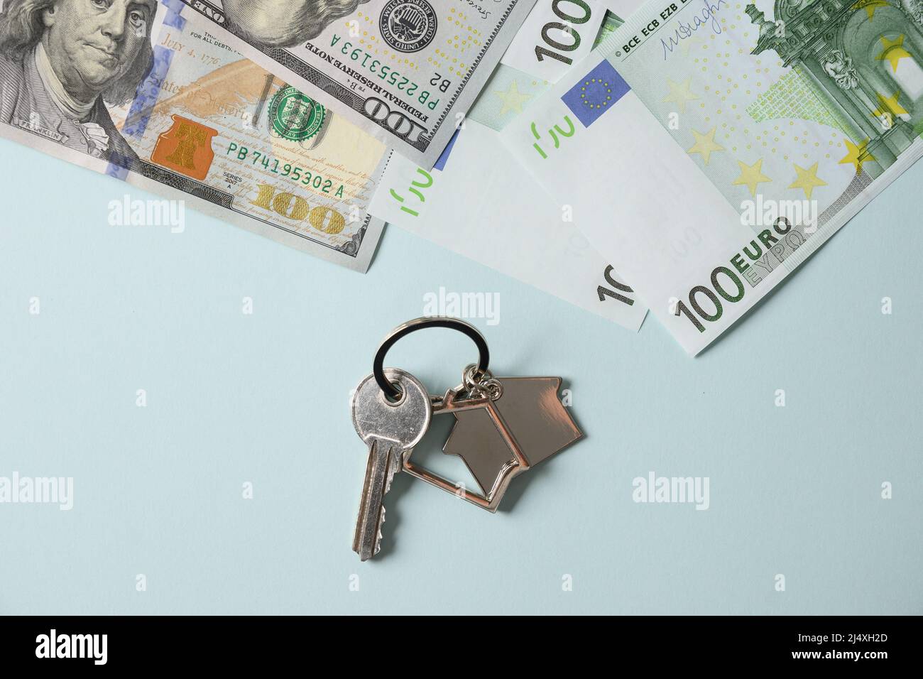 Key for a new house or apartment and currency paper banknotes euro ...