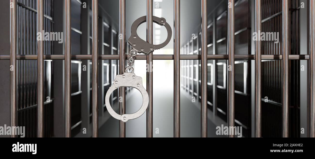 Handcuffs on jail cell closed metal bars door. Prison building corridor ...