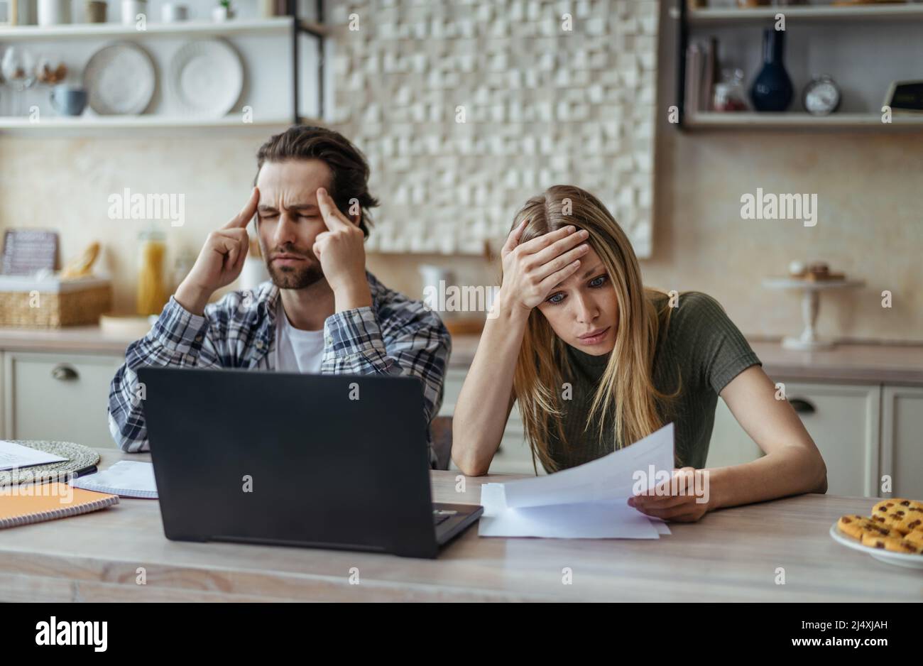 Sad Shocked Millennial Caucasian Husband With Stubble And Wife Pay