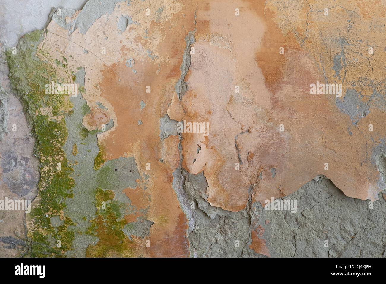 Old flaky wall with destroyed plaster. Renovation of old house ...