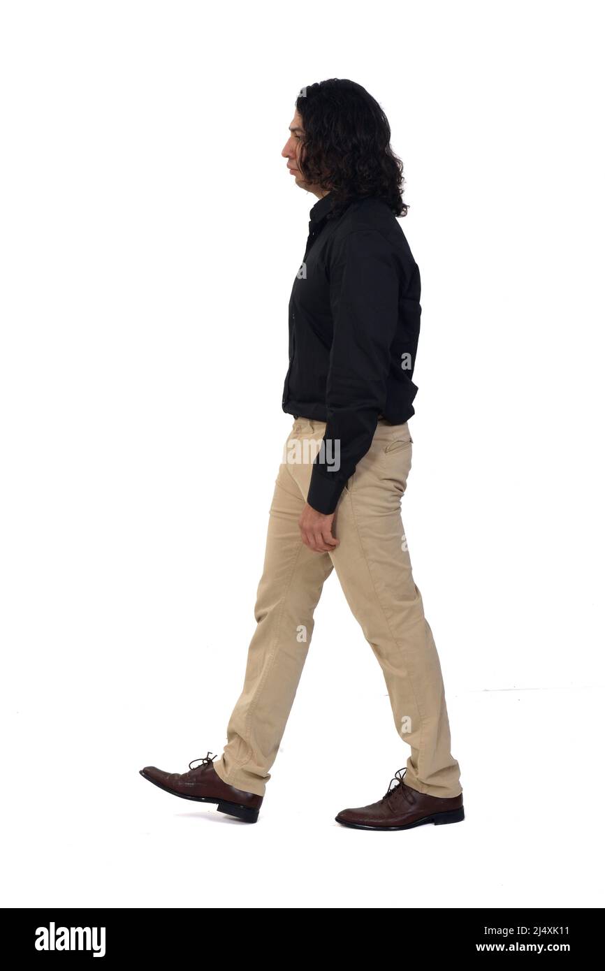 side view of a man with long hair walking white background Stock Photo ...
