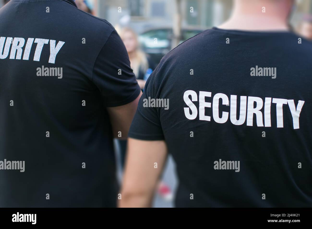two security guards standing on street Stock Photo - Alamy