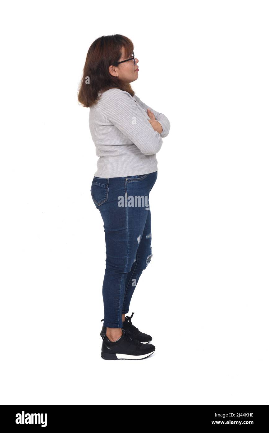 side view of a woman with arms crossed on white background Stock Photo ...