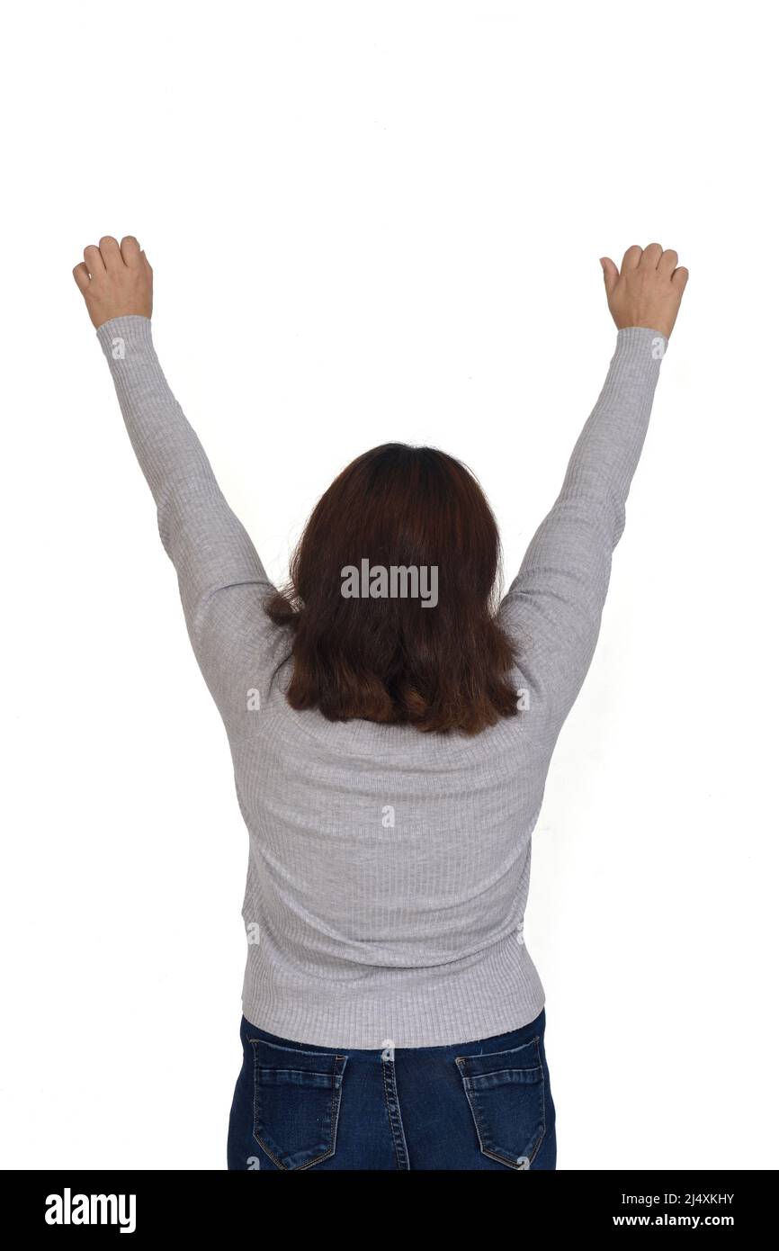 portrait of a woman with arms raised on white background Stock Photo ...