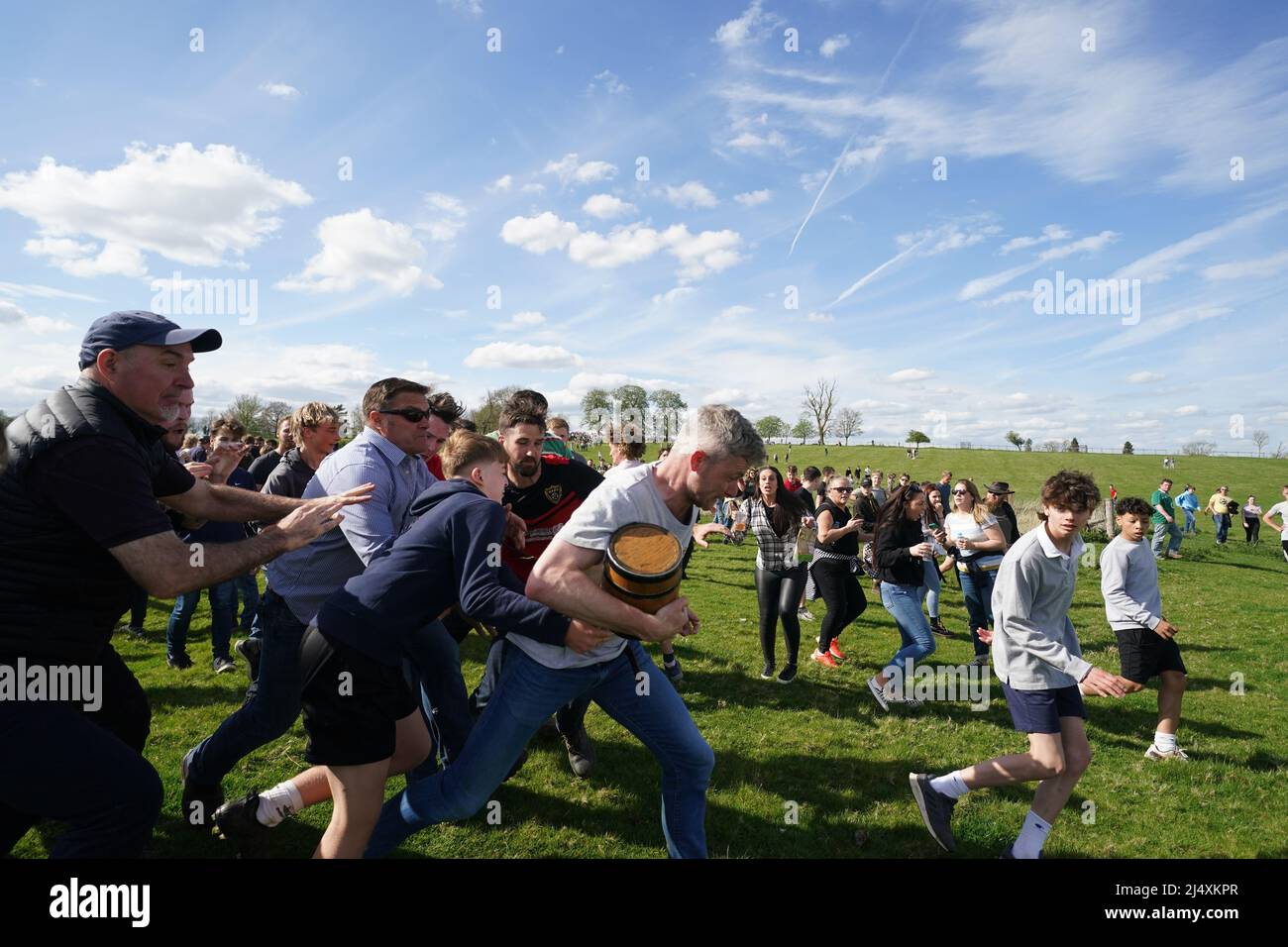 Players pass the 'bottle', an old field barrel holding about a gallon ...