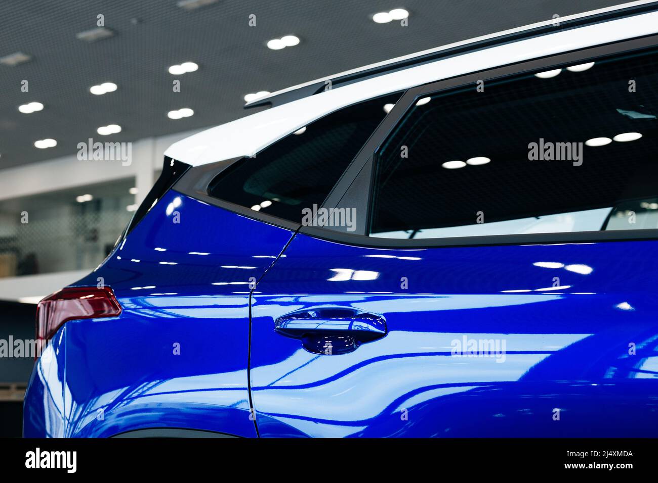 Side view of turning luxury blue car Stock Photo - Alamy