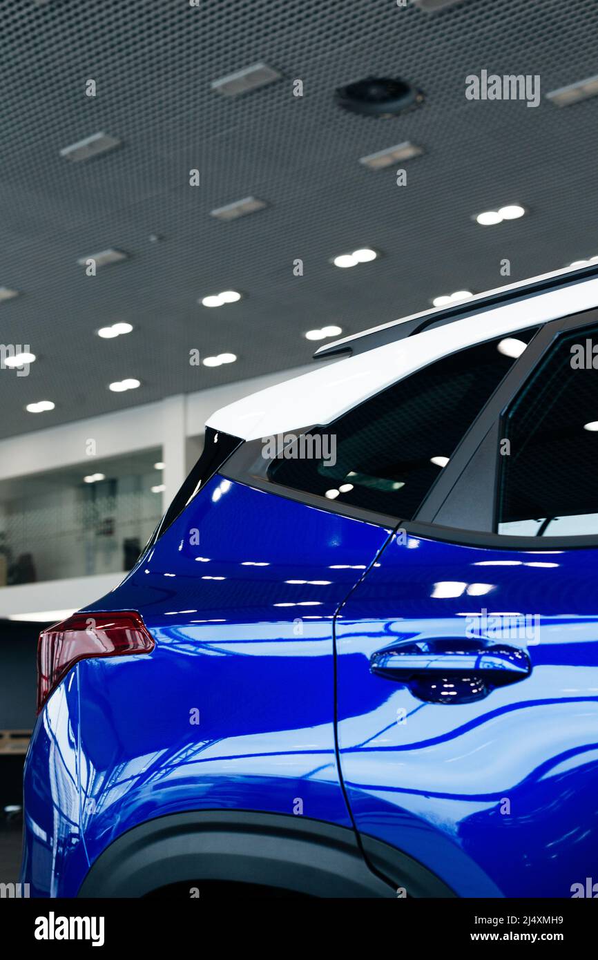 Side view of turning luxury blue car Stock Photo - Alamy