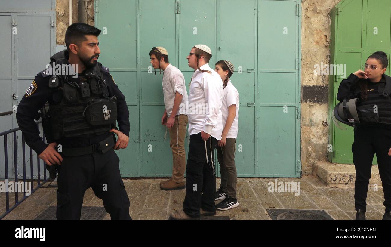 Members of the Israeli Security Forces stand guard as young religious ...