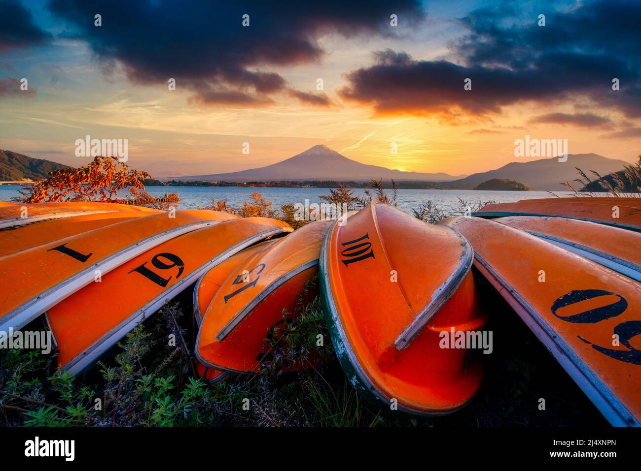 Mt. Fuji over Lake Kawaguchiko with boats at sunset in Fujikawaguchiko, Japan Stock Photo - Alamy