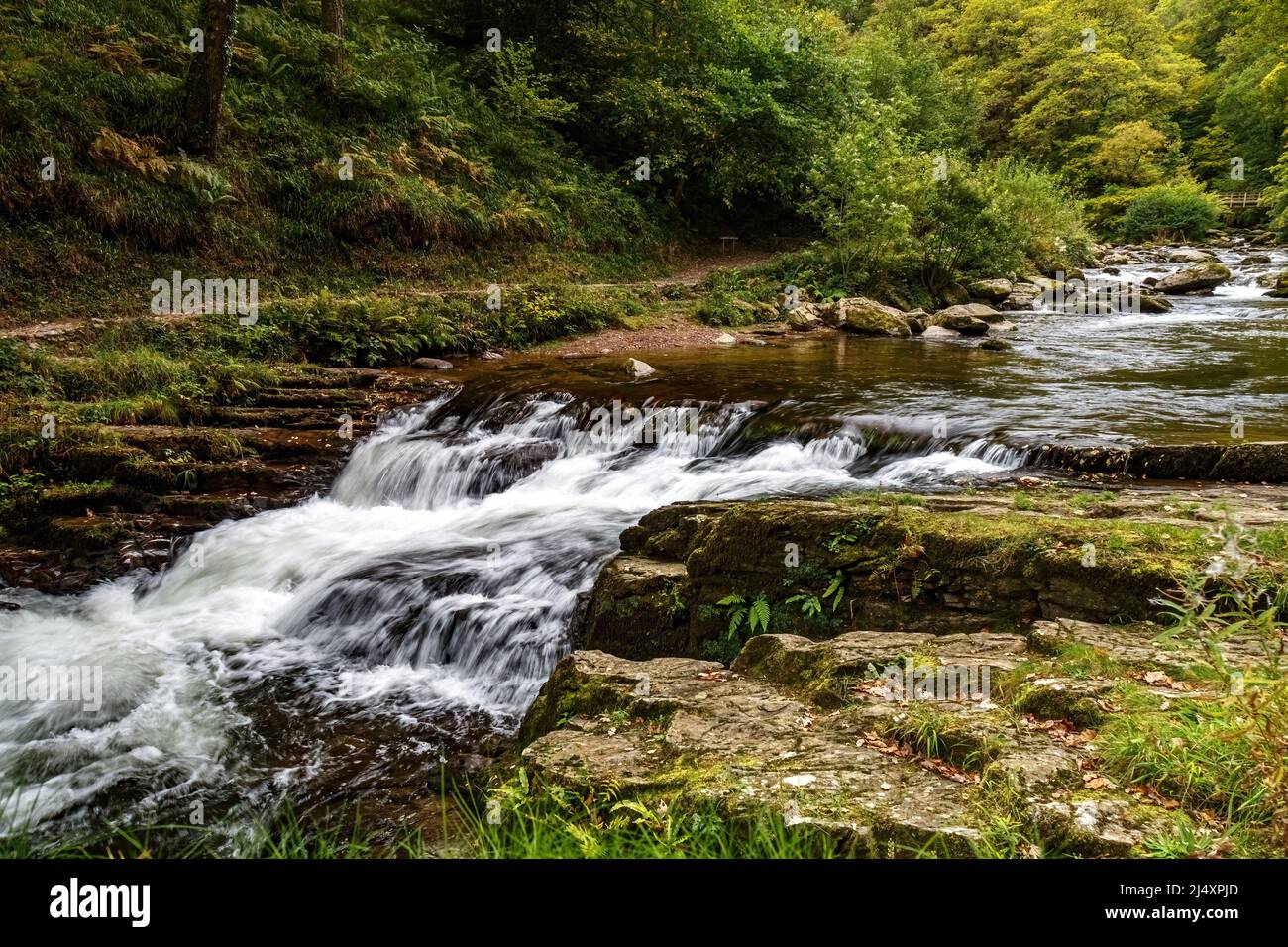 Easy Lyn river flowing over rocks creating waterfalls and rapids with ...