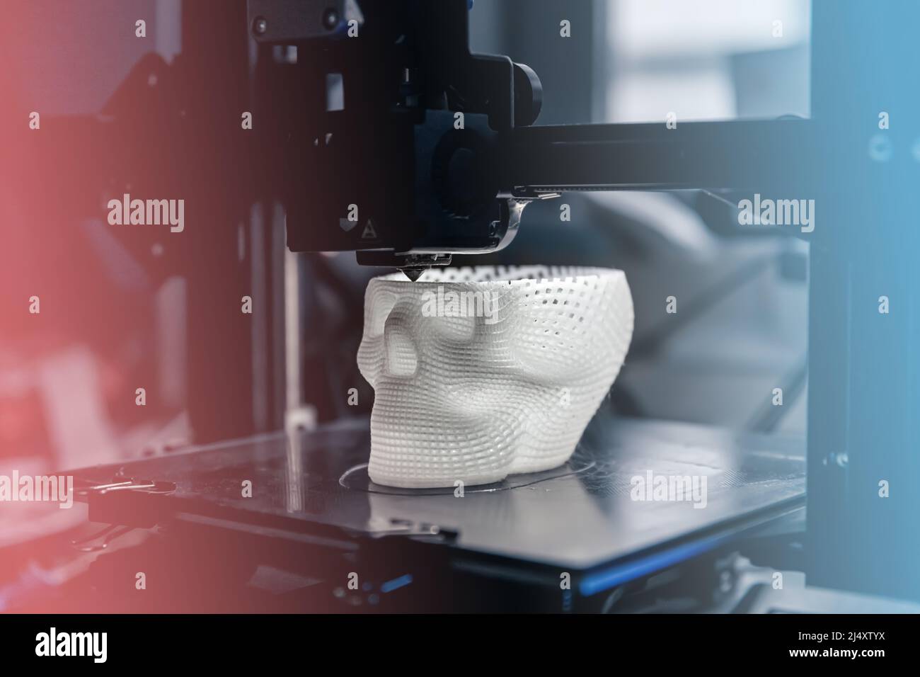 The 3D printer prints white plastic model Stock Photo - Alamy