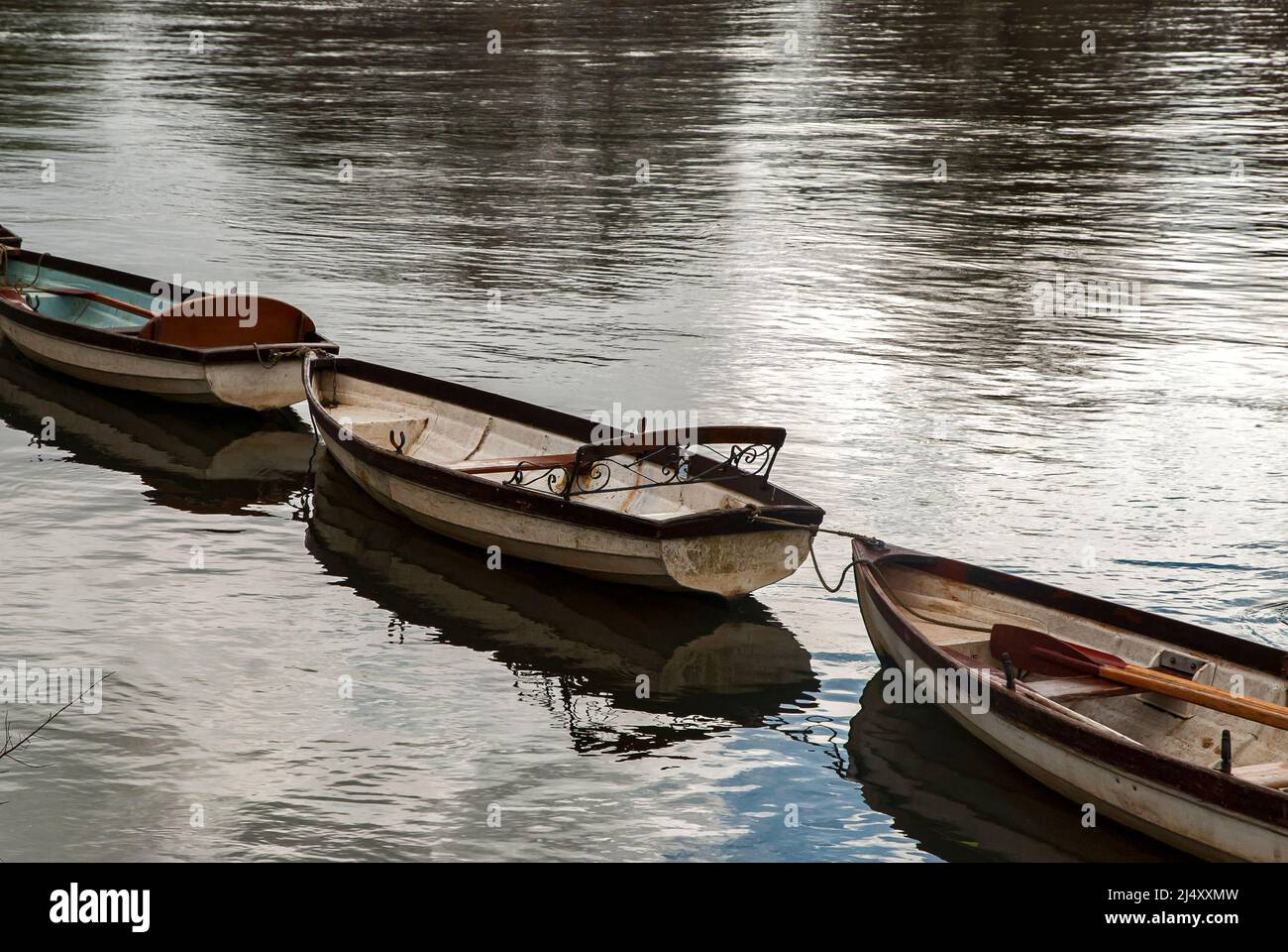 Punt flat bottom river wooden boats on river Thames waters in Richmond ...