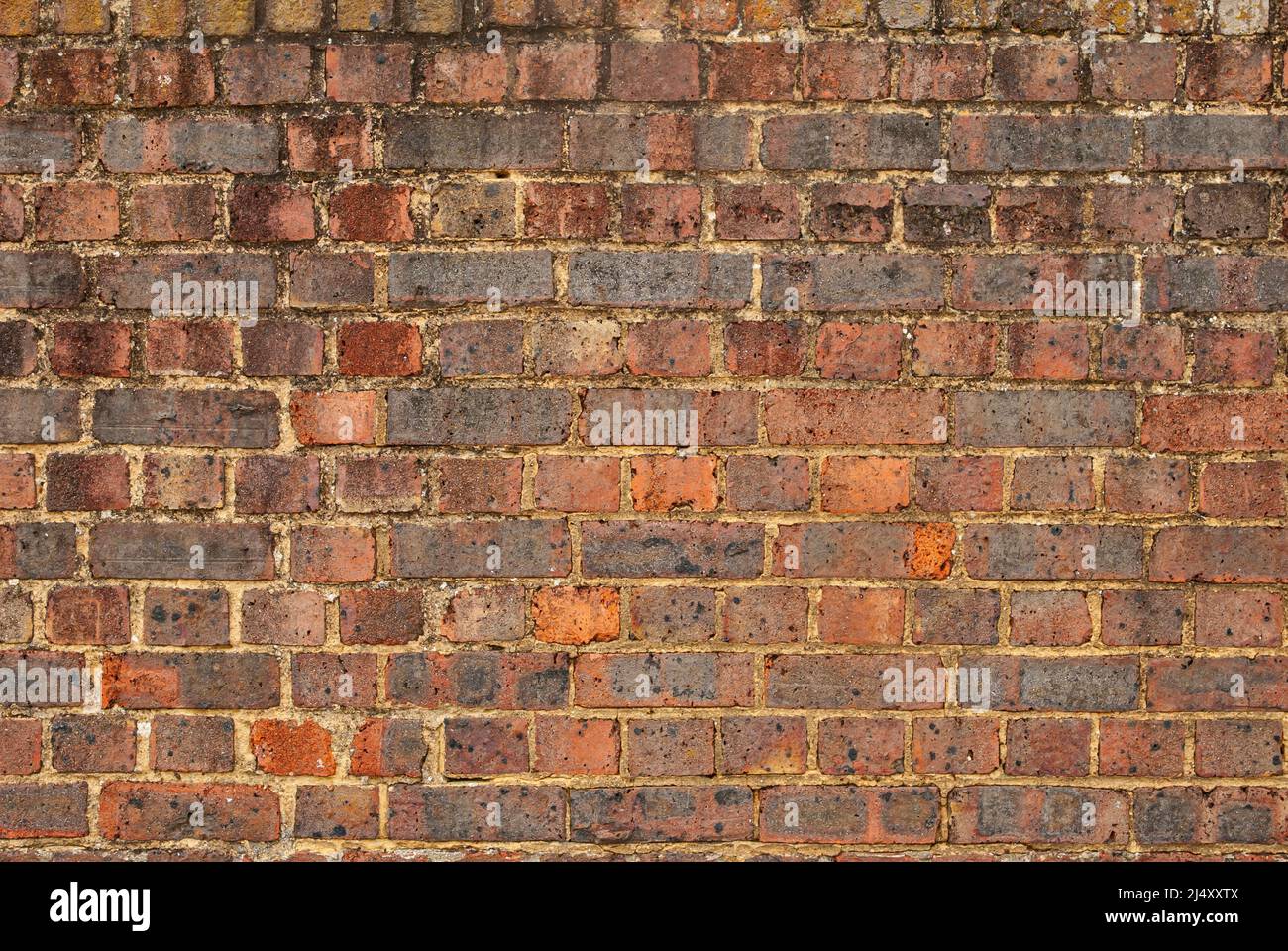 Old weathered red brick wall closeup as background Stock Photo - Alamy