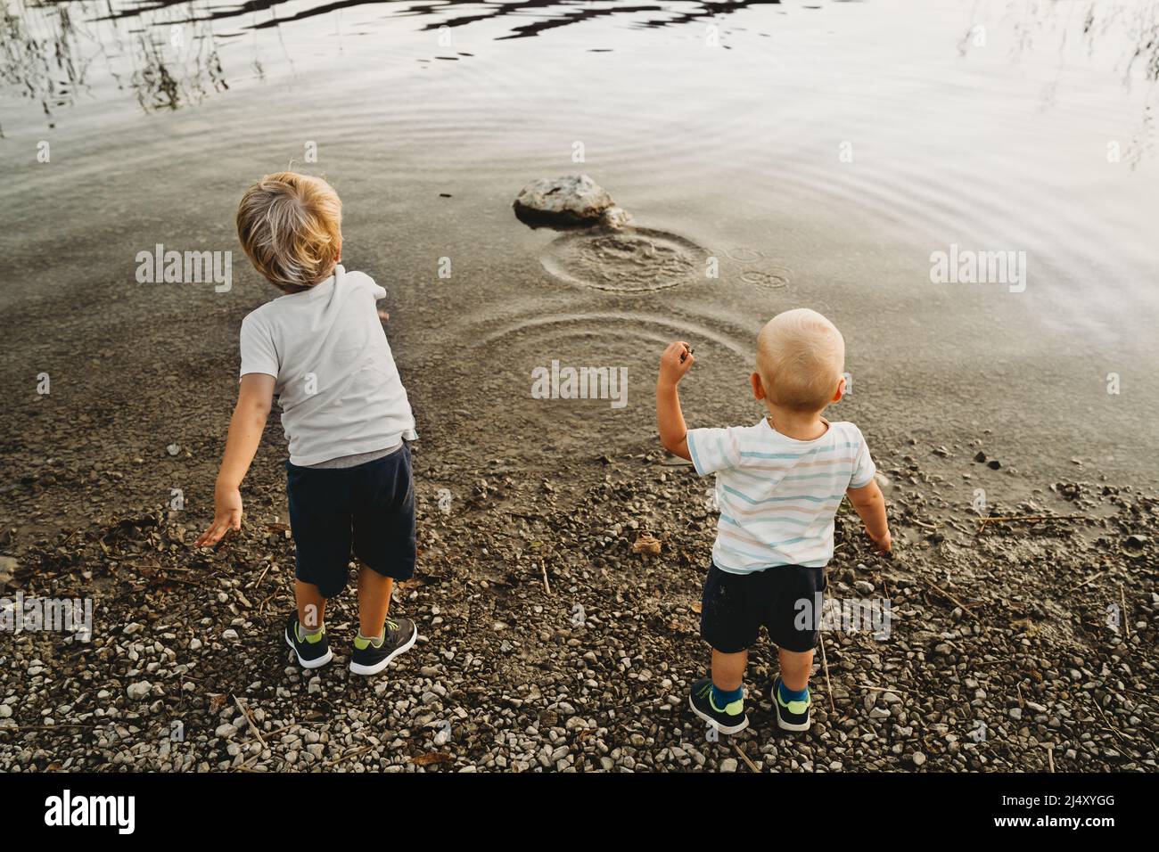 Children throwing stones hi-res stock photography and images - Alamy