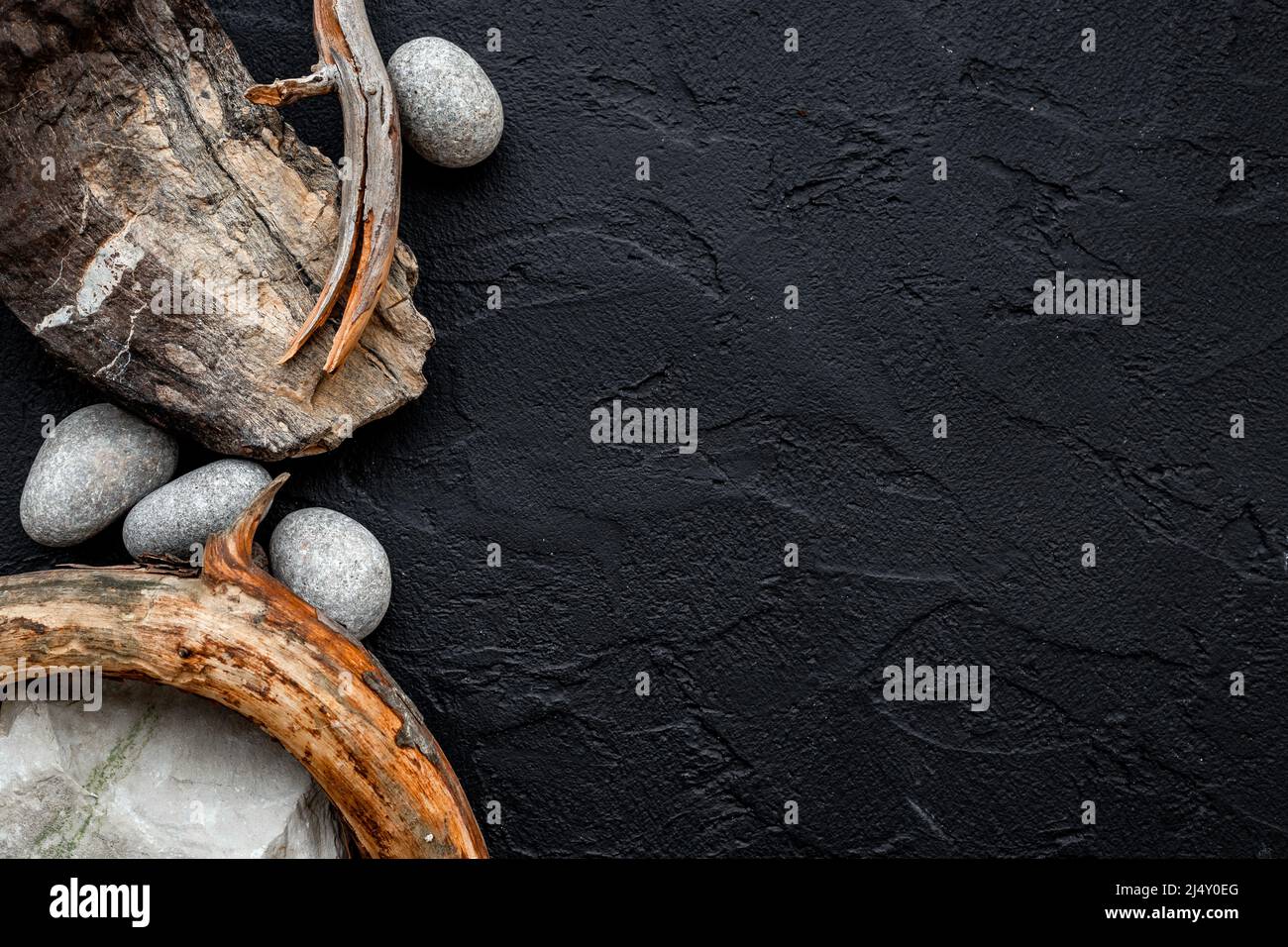 Frame of natural mineral rocks with snag tree branch Stock Photo - Alamy