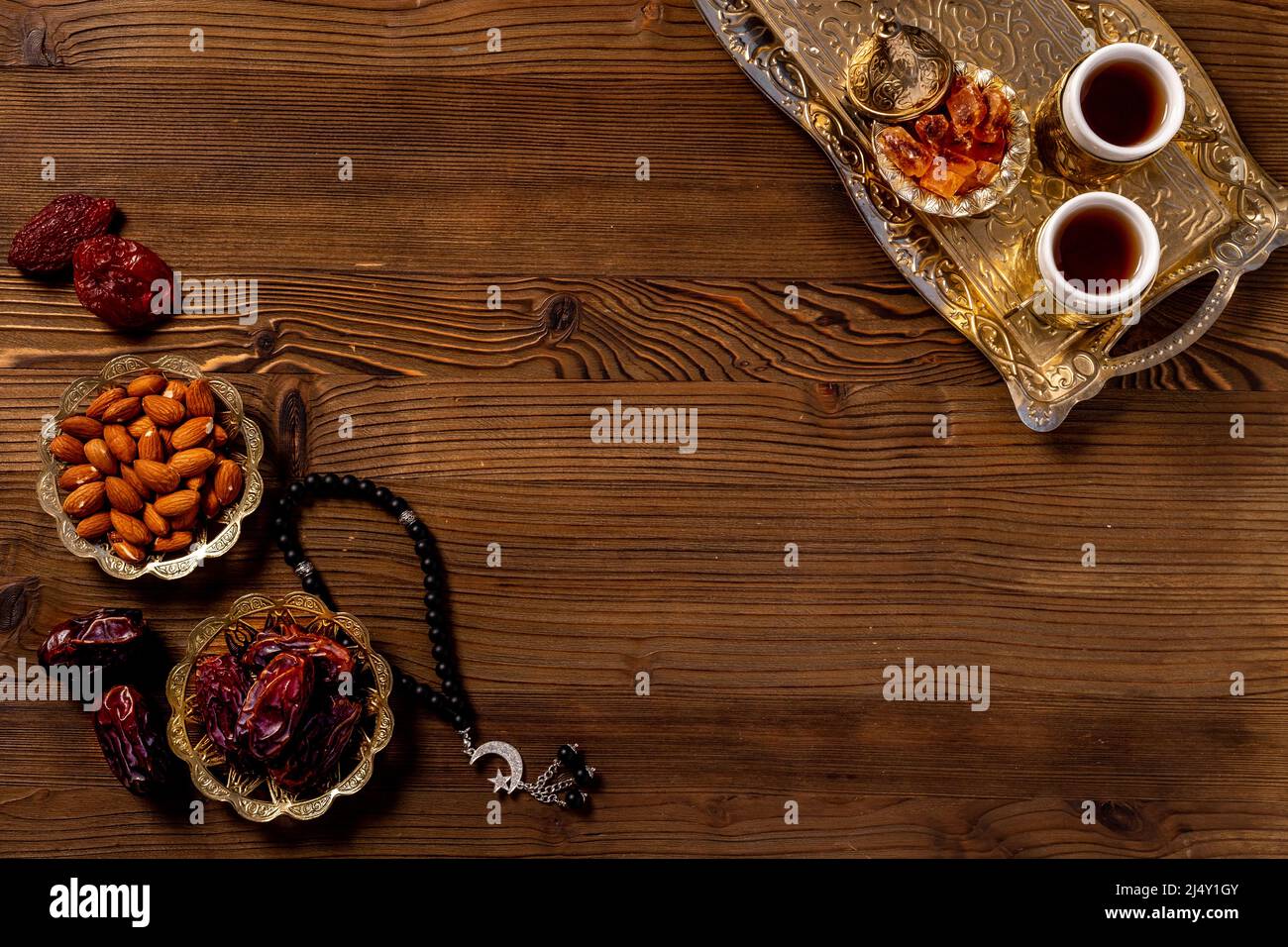 Ramadan holyday table with dates fruits and islamic rosary with star ...