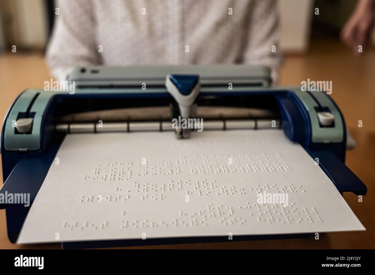Blind woman using braille typewriter Stock Photo - Alamy