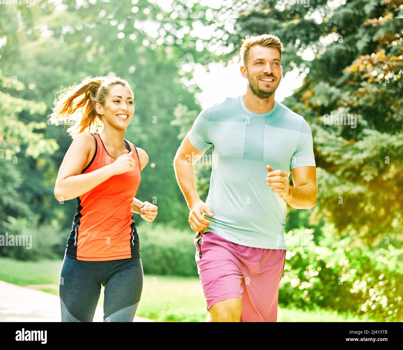 fitness woman park exercise lifestyle outdoor sport healthy couple ...