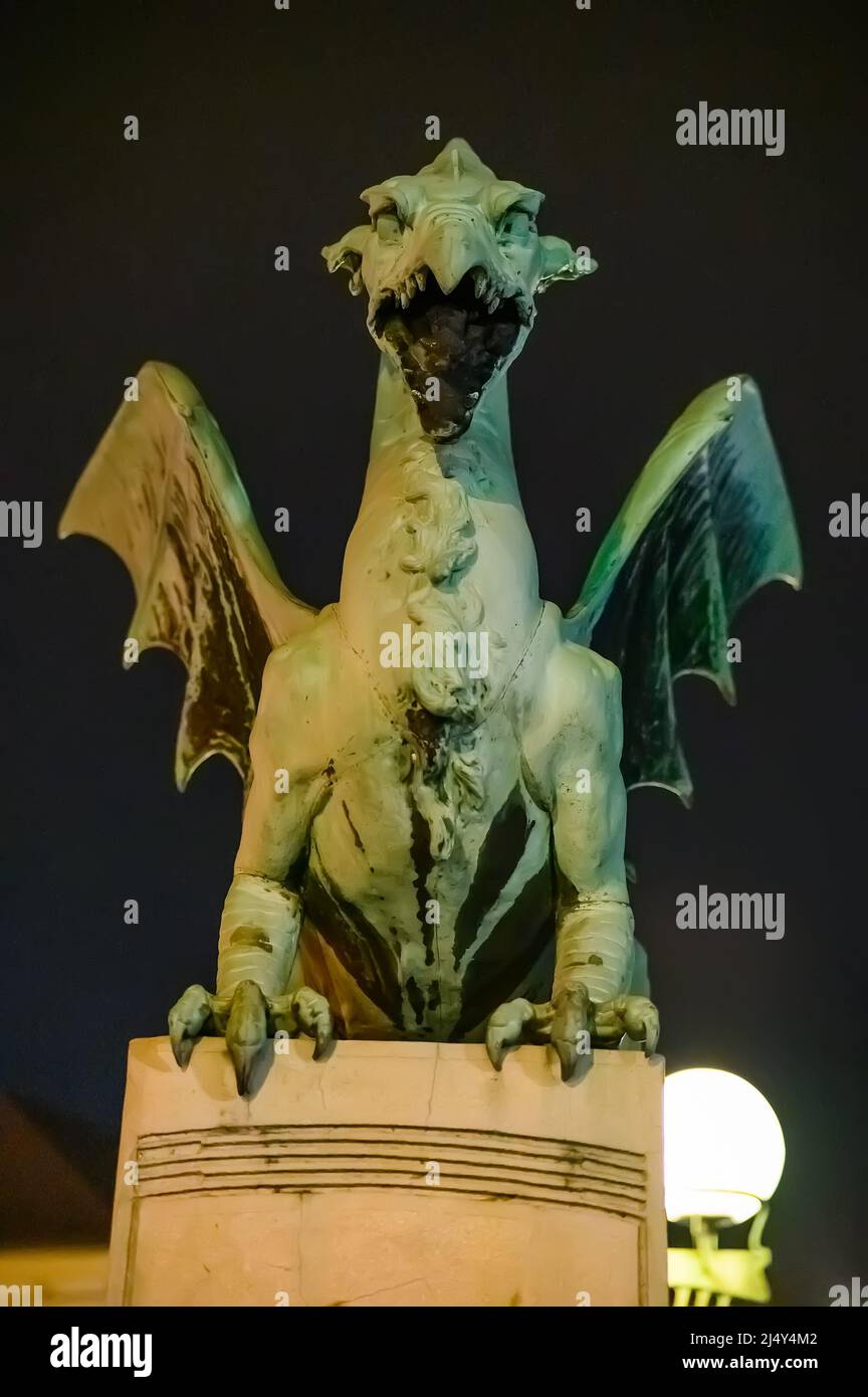 View on the Famous Dragon bridge and the Dragon statue Zmajski at night ...