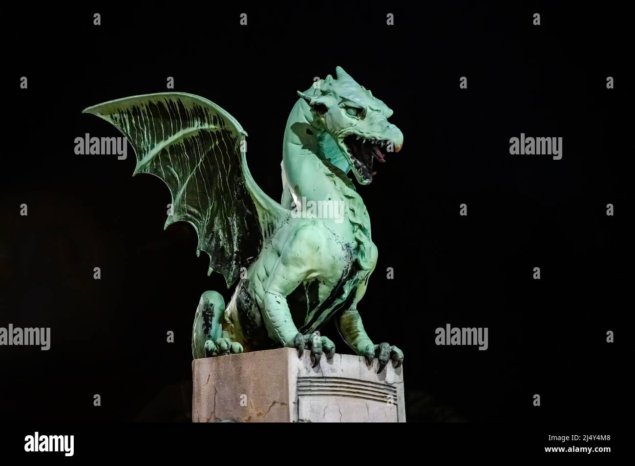 View on the Famous Dragon bridge and the Dragon statue Zmajski at night ...