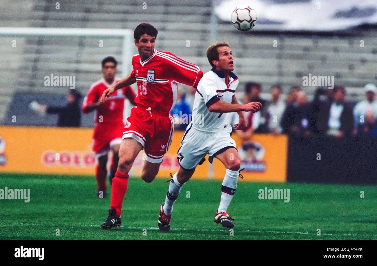 Lyon, France: Ali Akbar Ostad-Asadi (15) of Iran comes up behind Joe ...