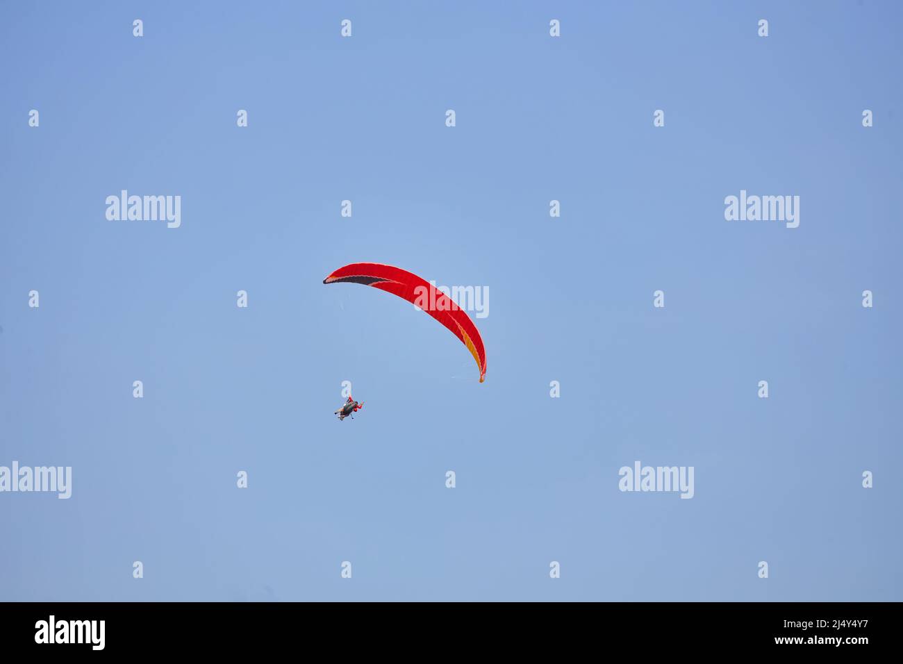 Paragliding in the sky. Paraglider flying in bright sunny day ...