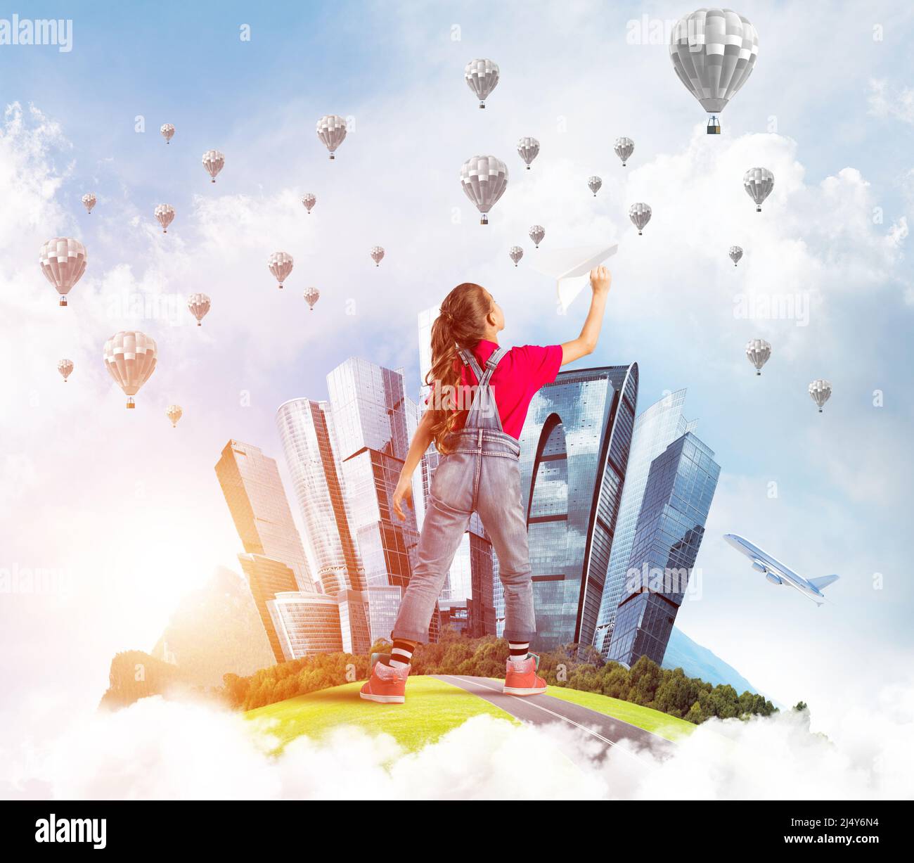 Concept of careless happy childhood with girl dreaming about future ...