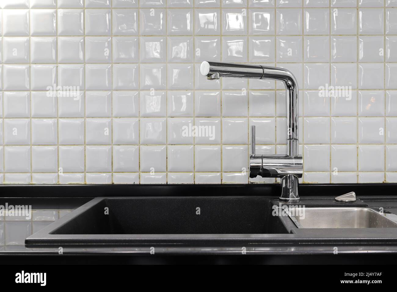 Faucet and sink in the modern kitchen Stock Photo - Alamy
