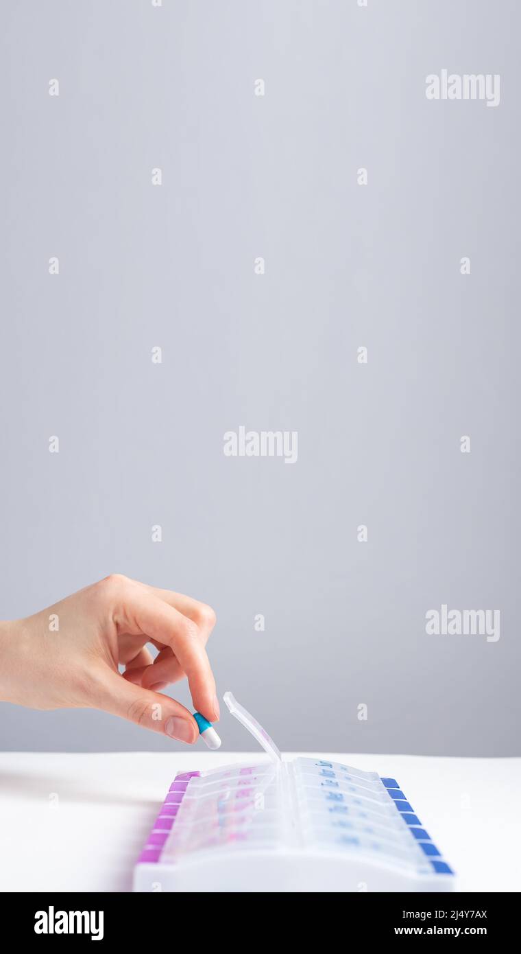 Banner with woman hand taking pill, vitamin from case, organizer ...