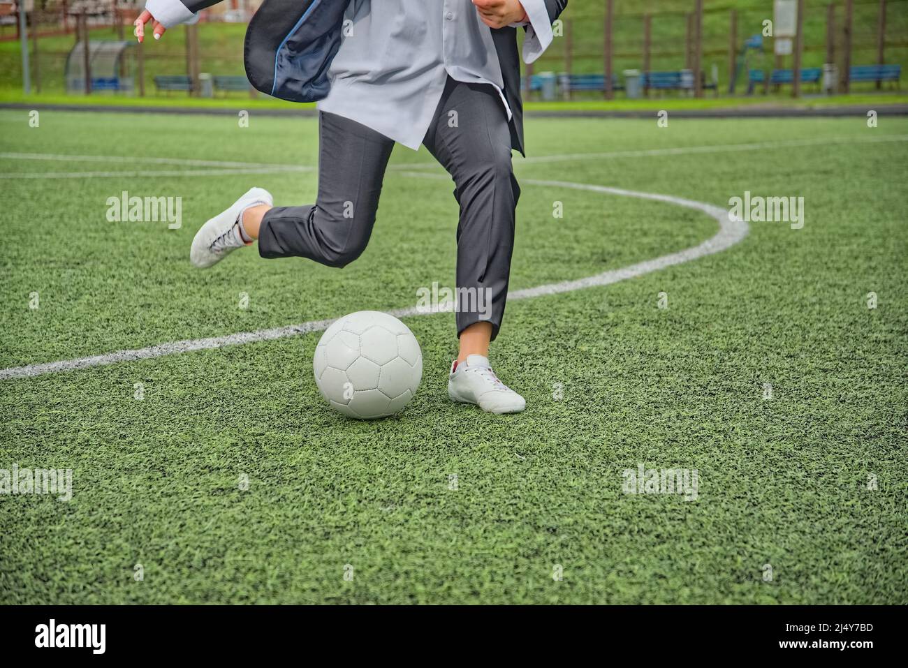 female soccer player kicking the ball in the stadium Stock Photo - Alamy
