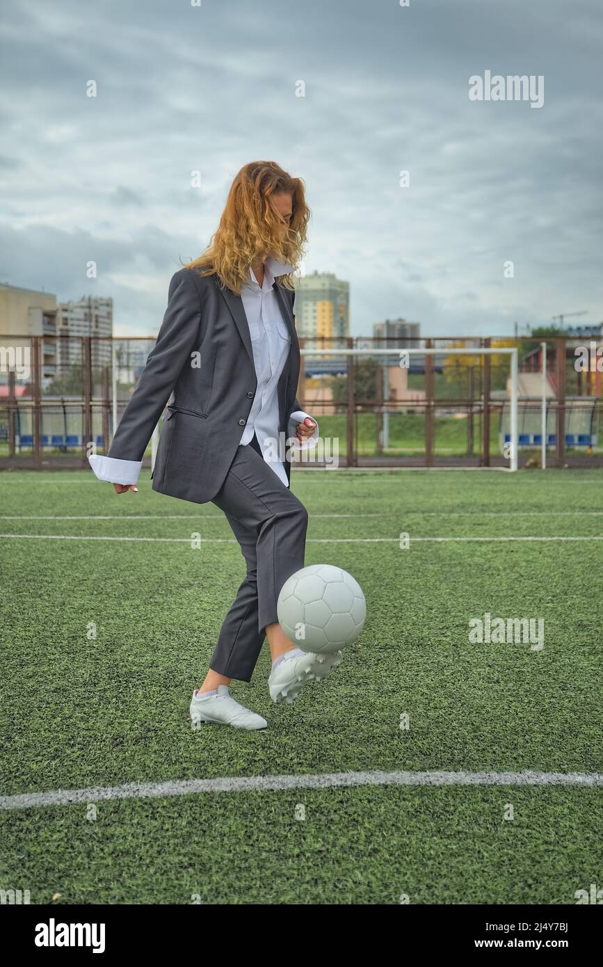 woman soccer player with ball on the field. ball dribbling, feint Stock ...