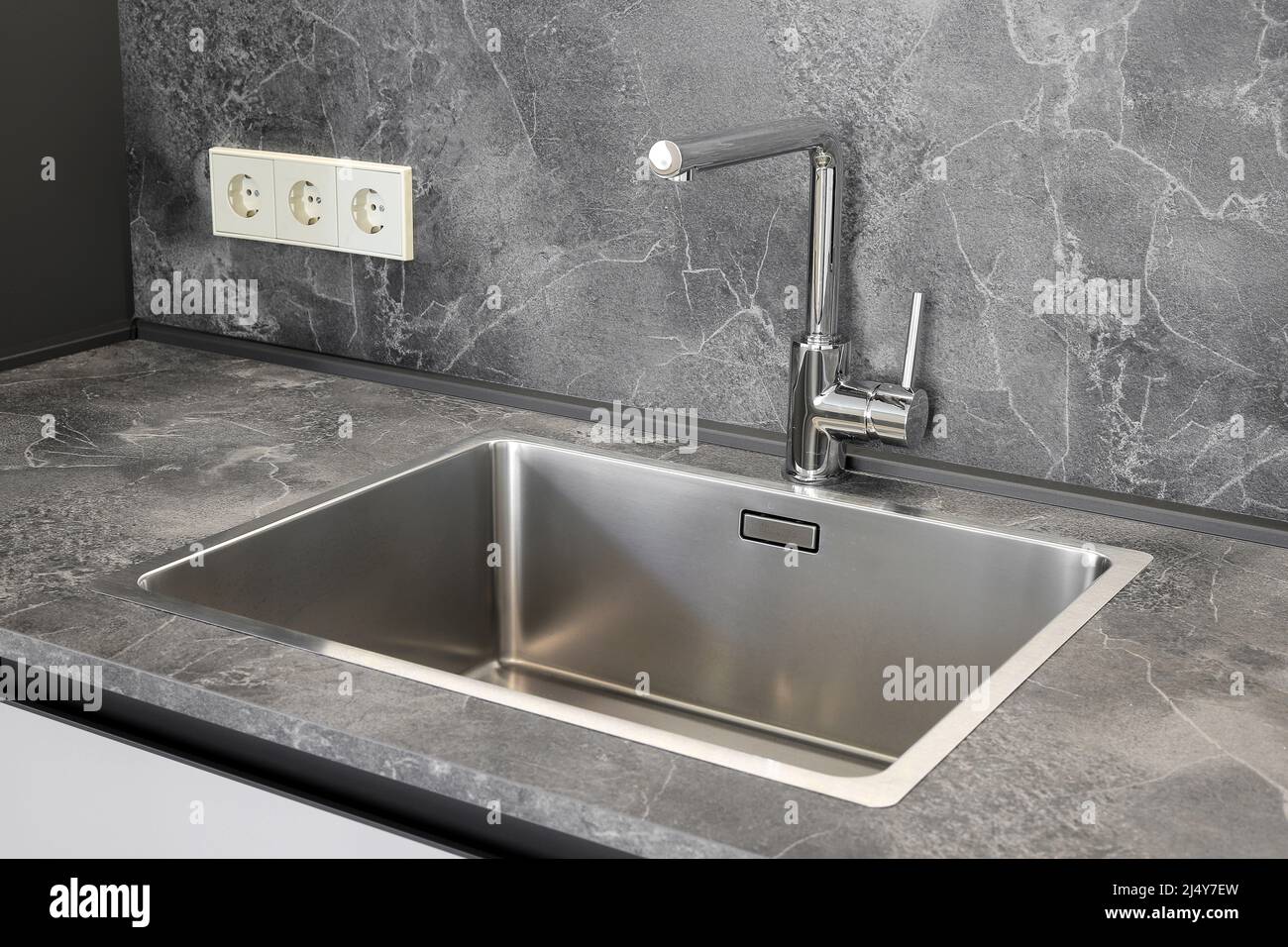 Faucet and sink in the modern kitchen Stock Photo - Alamy