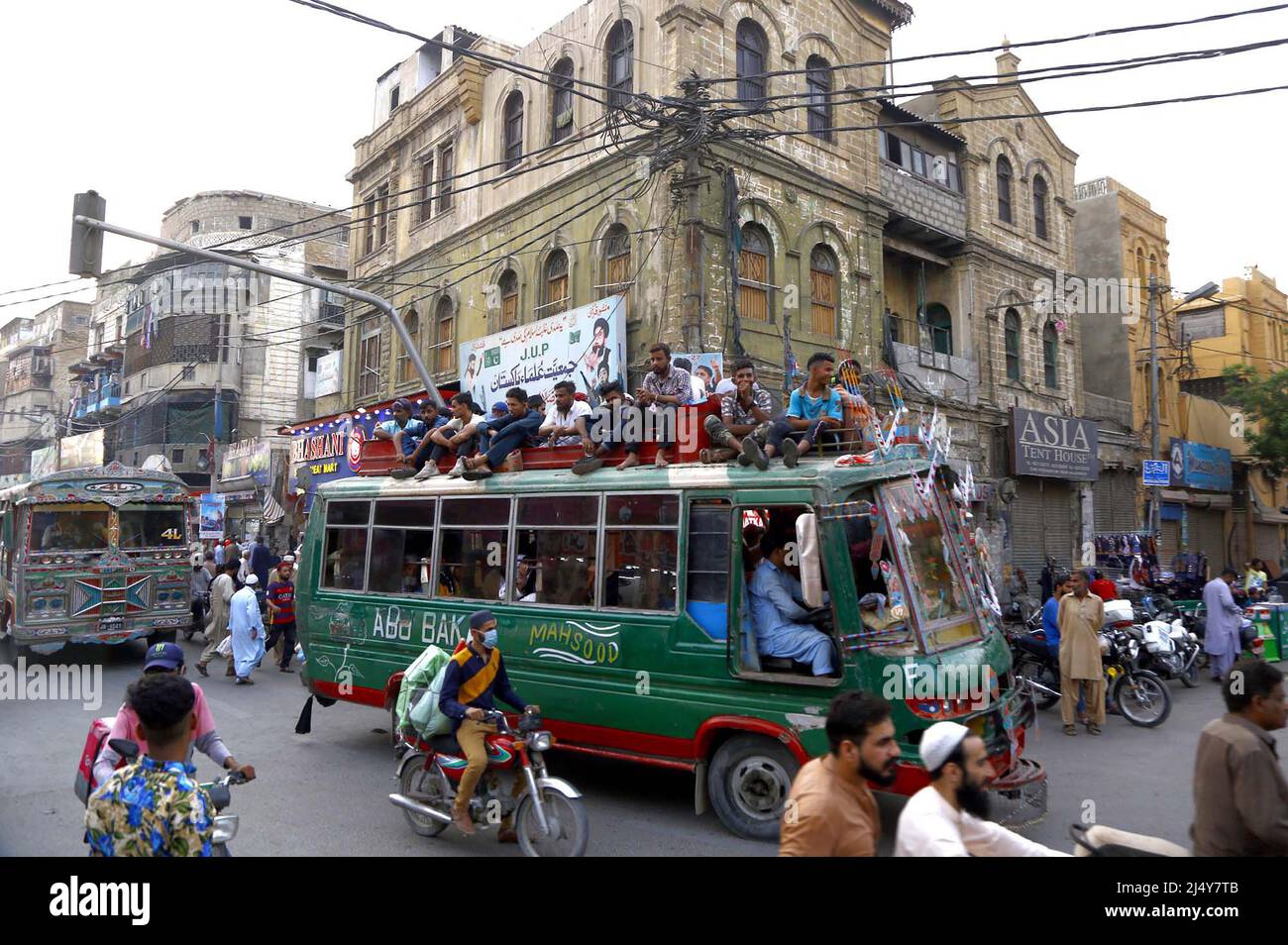 Passengers travelling on an overloaded bus as the short of public ...
