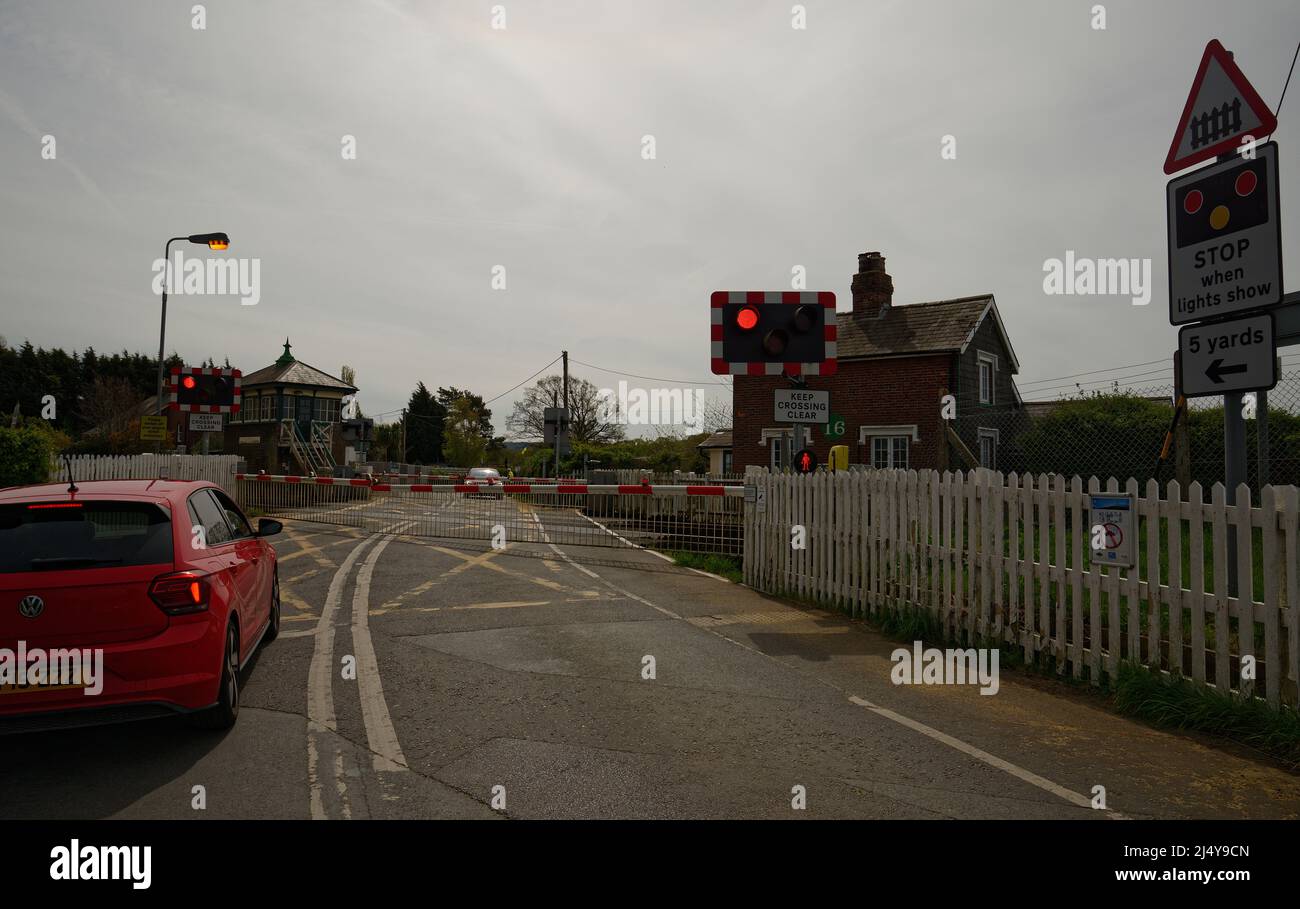 A level crossing. Cars awaiting the train at a country level crossing ...