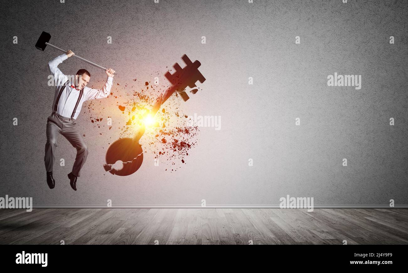 Breaking through access concept with furious man in room crashing ...