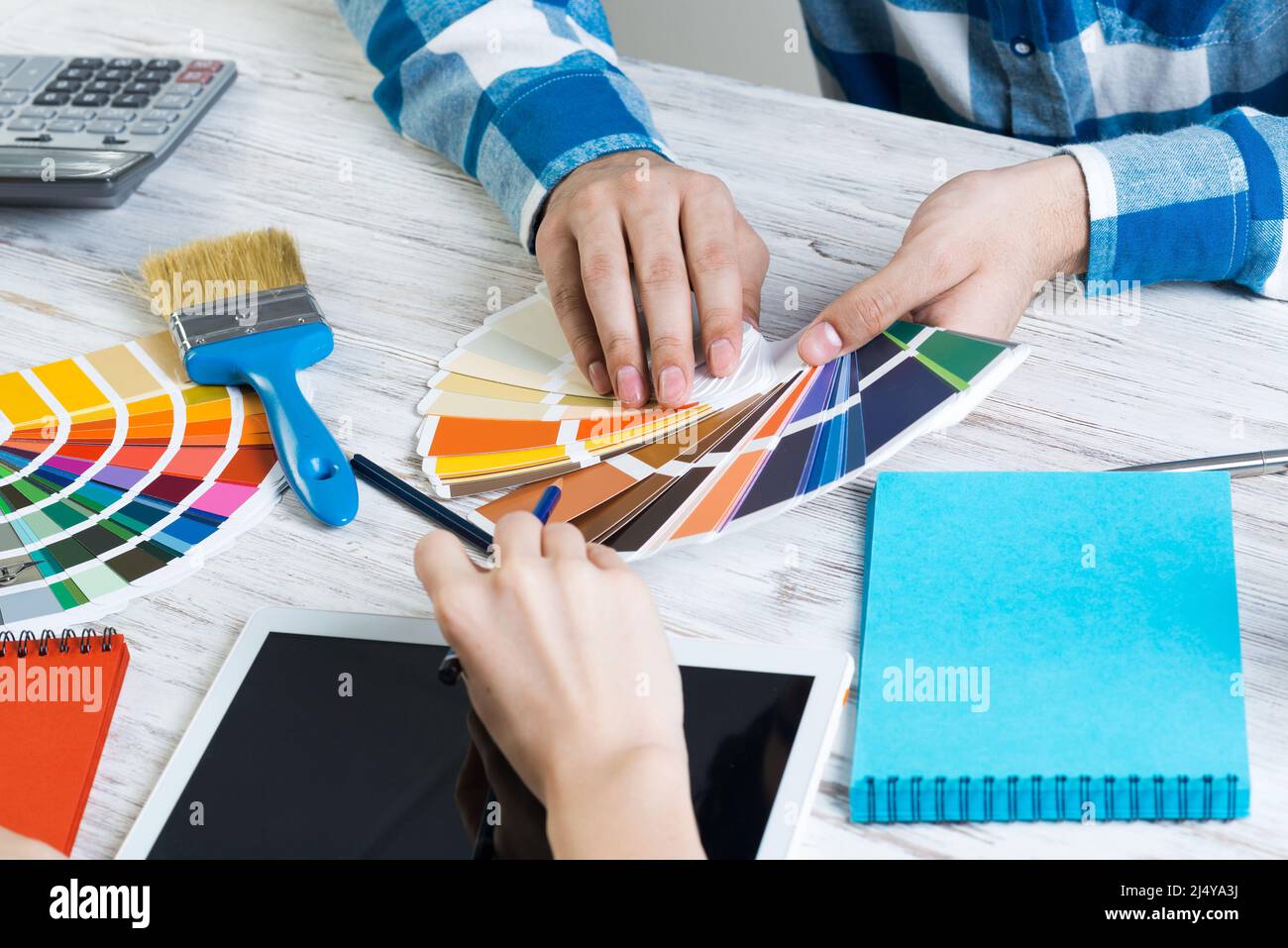 Interior designer choosing colors from swatches Stock Photo - Alamy