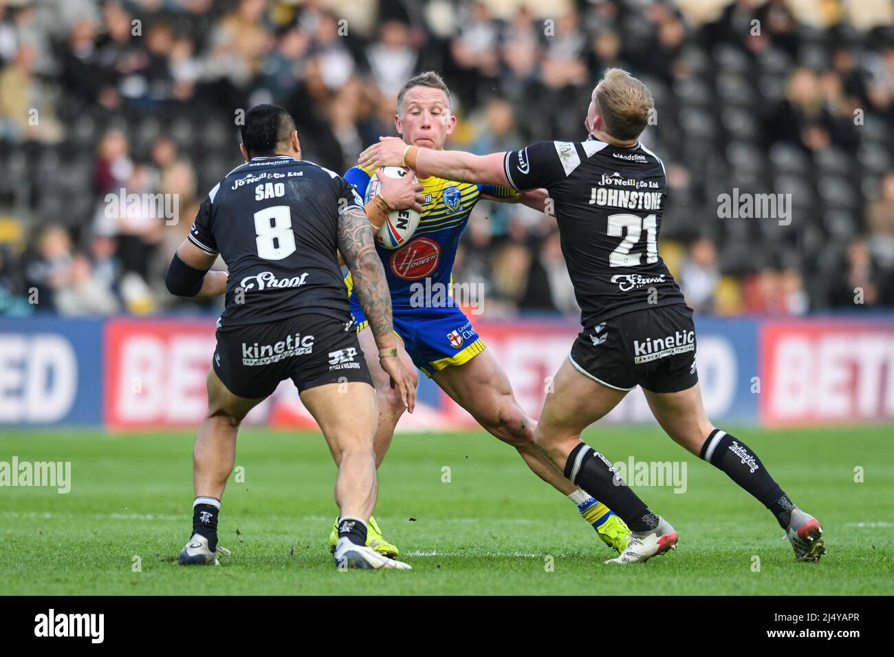 Jason Clark #14 of Warrington Wolves runs forward with the ball Stock ...
