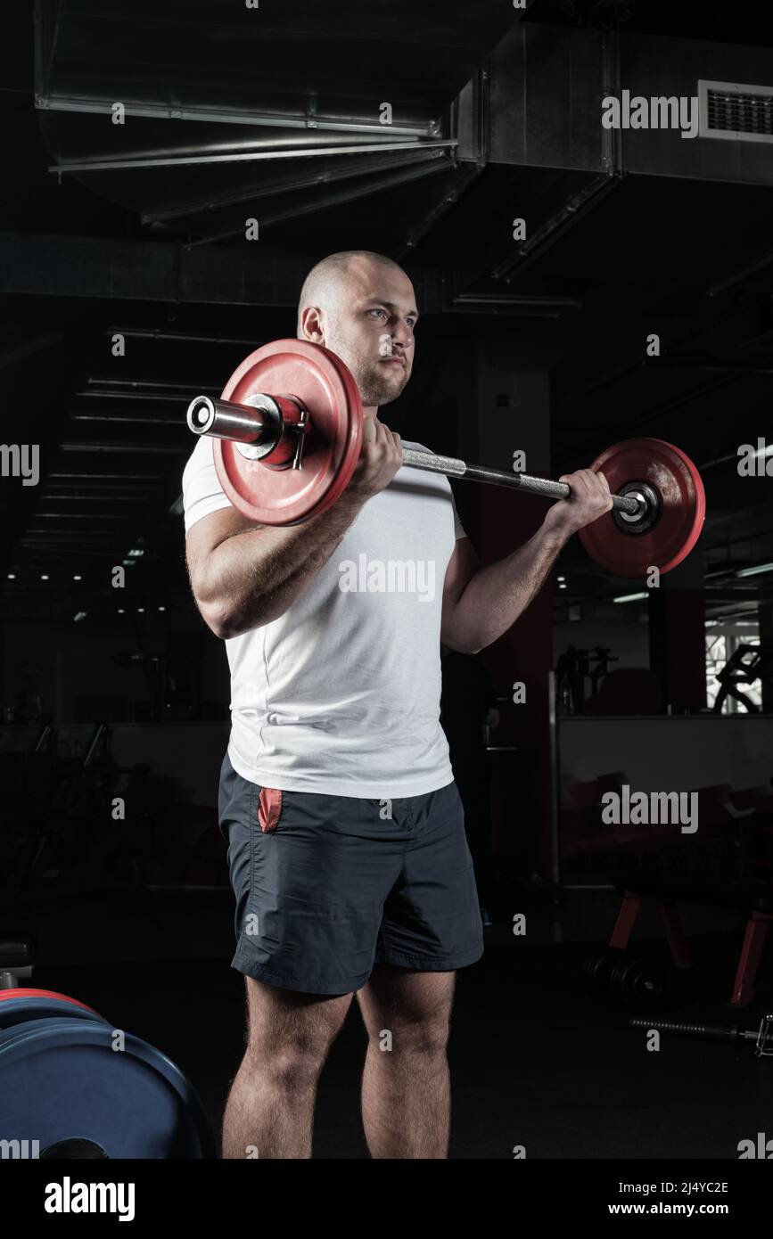 Young athlete lifts heavy barbell hi-res stock photography and images ...