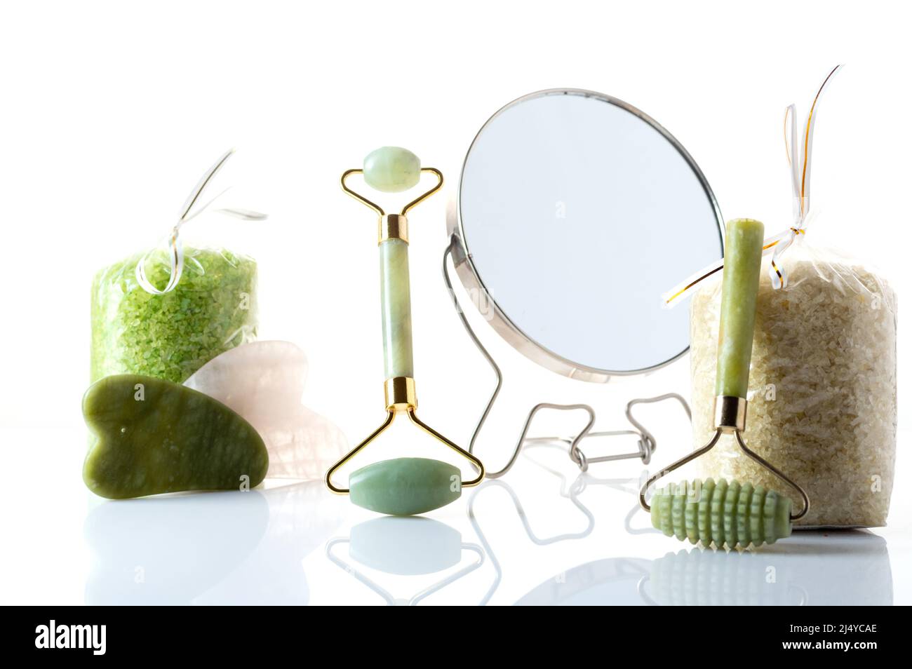 Women's mirror and beauty rollers for the face. Facial skin care ...