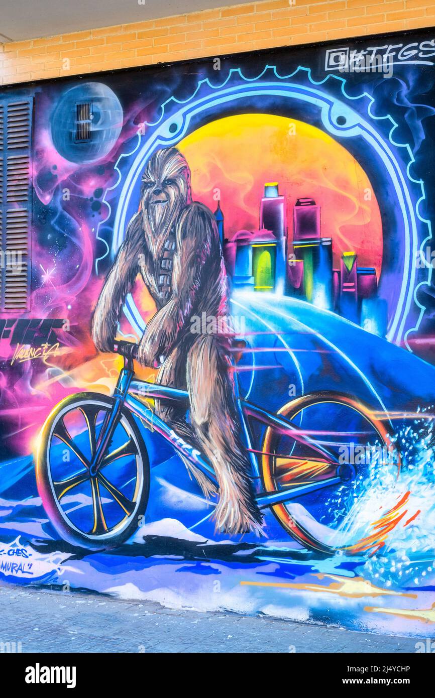 A multi-color graffiti or urban art by the TFGS bicycle store. Valencia ...