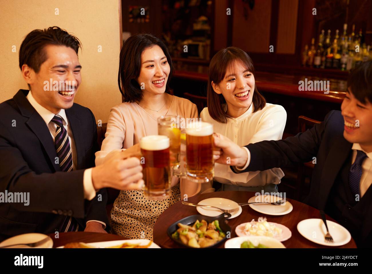 Japanese businesspeople having drinks and dining at a bar Stock Photo ...