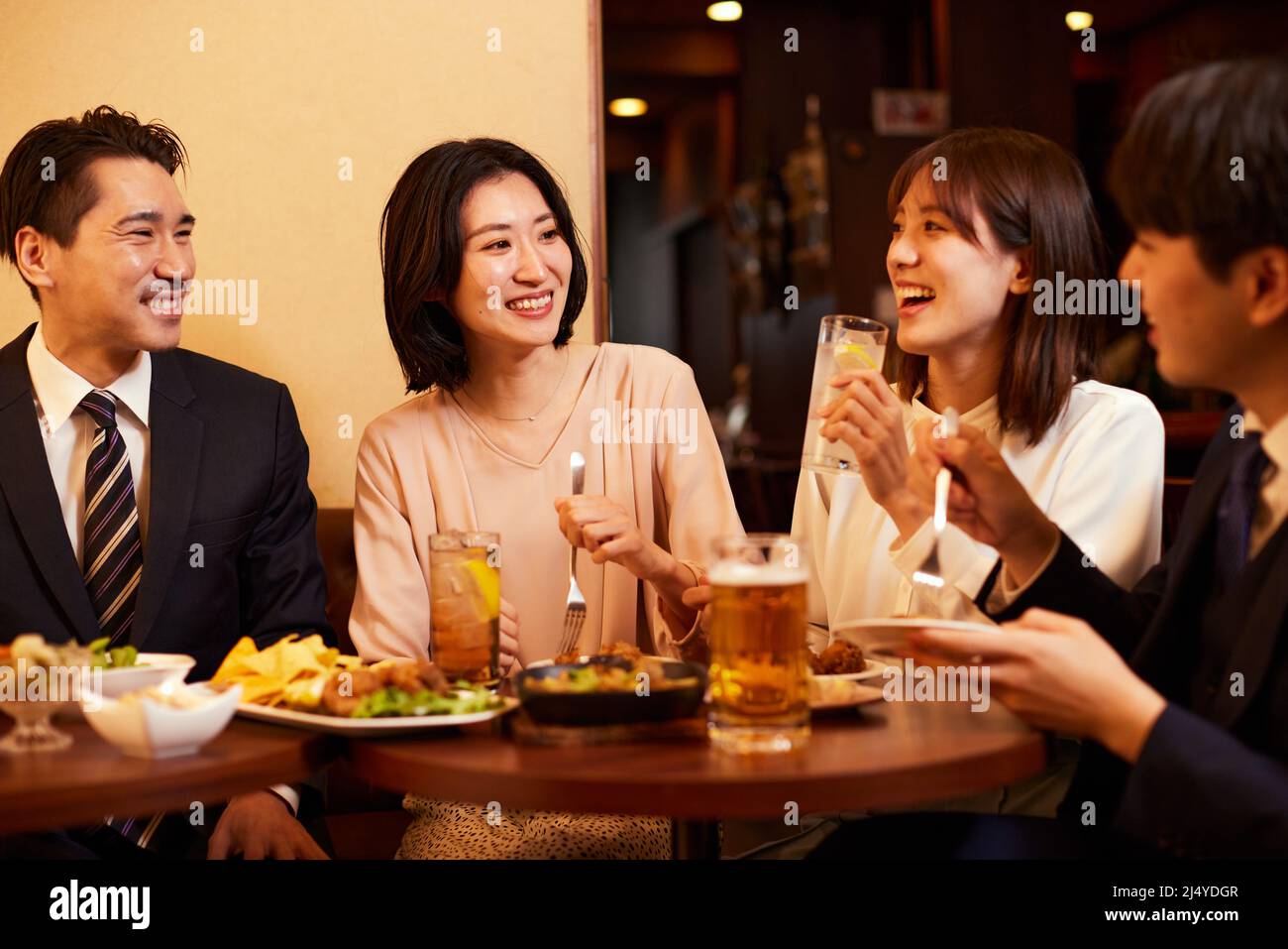 Japanese businesspeople having drinks and dining at a bar Stock Photo ...